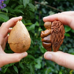 Artisan Transforms Avocado Stone into Intricate Handheld Totems