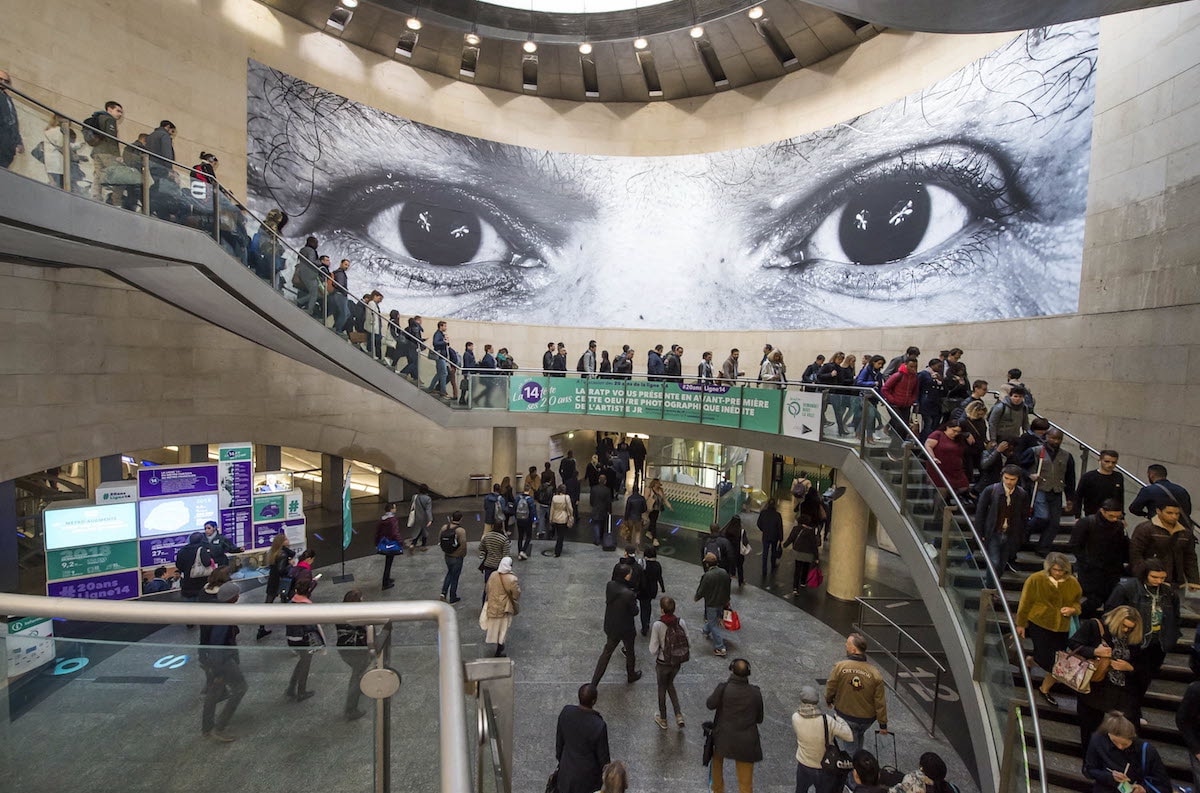 Street Artist JR Takes Over the Paris Metro with His Poster Art
