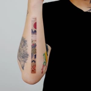 Elegant Rectangle Tattoo Designs Reveal a Sliver of Colorful Scenes