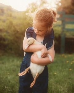 Adorable Children With Baby Animal Photos Showcase Sweet Bonds