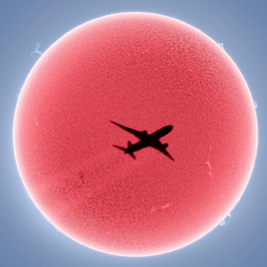 Photographer Accidentally Captures Plane Flying Over Sun
