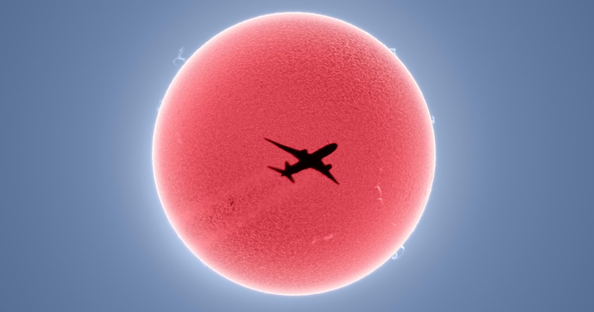 Photographer Accidentally Captures Plane Flying Over Sun