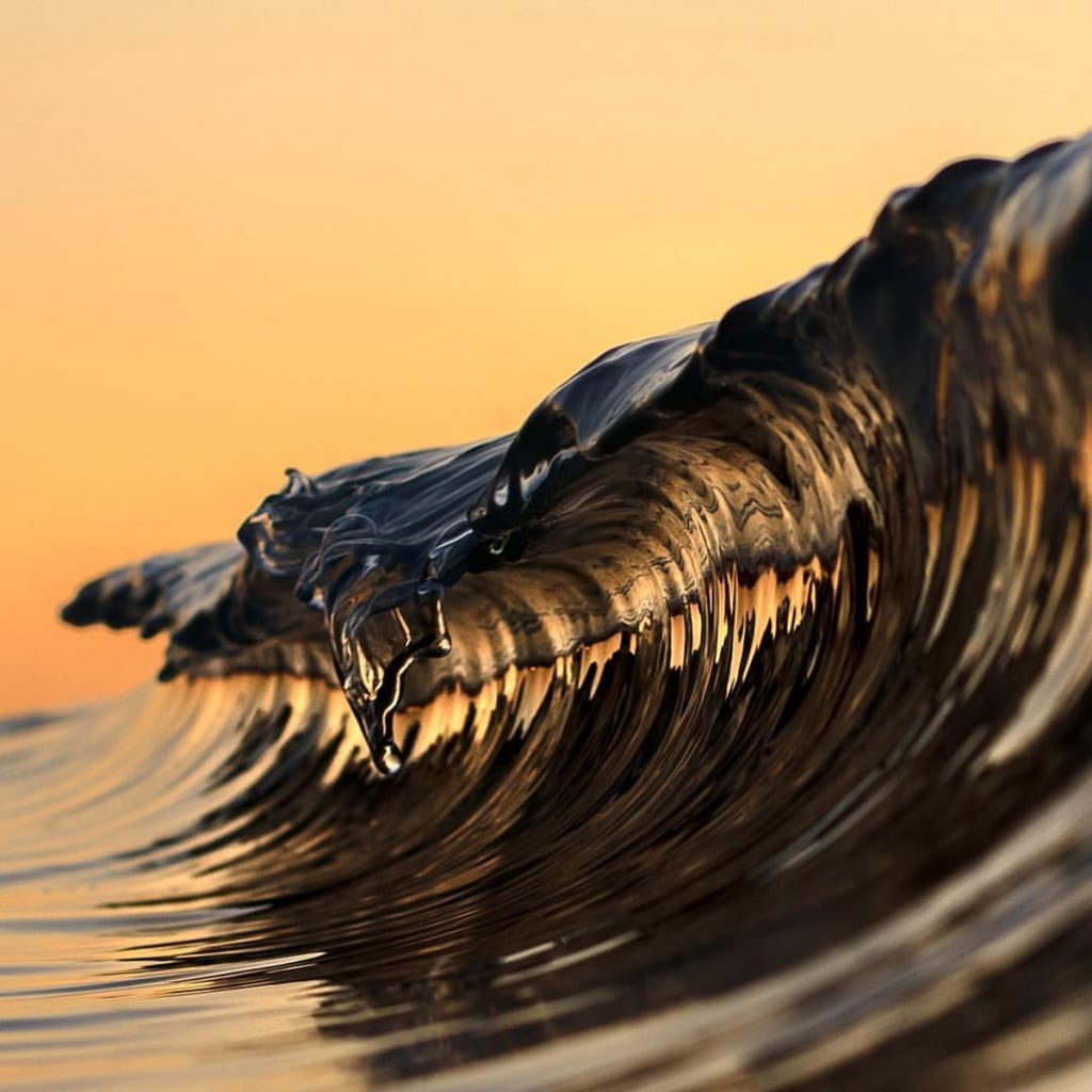 "Surfing" Photographer Captures Cresting Waves in Magical Seascapes