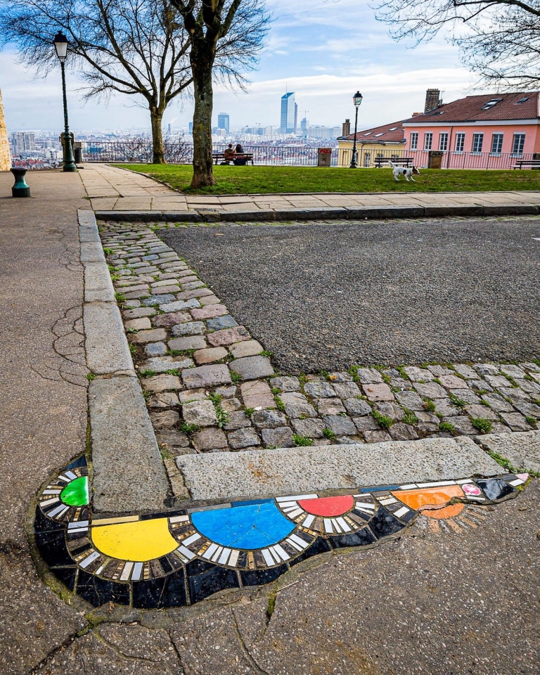 Street Artist Transforms Cracks in the Pavement Into Gorgeous Mosaics