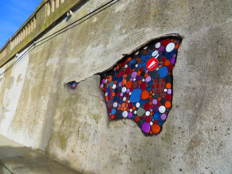 Street Artist Transforms Cracks in the Pavement Into Gorgeous Mosaics