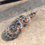 Artist Casts Small Multicolored Snake Figurines From Glass