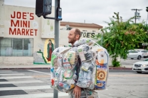 Man Wears a Custom Suit Showing All the Trash He Produced in a Month