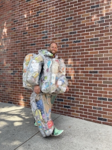 Man Wears a Custom Suit Showing All the Trash He Produced in a Month
