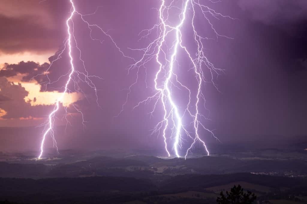 Stunning Photo of Lightning Bolt Framed by a Double Rainbow