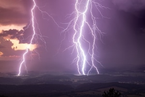 Stunning Photo of Lightning Bolt Framed by a Double Rainbow