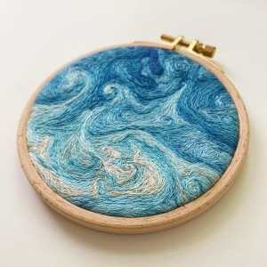 Aerial Embroidery Recreates the Swirling Beauty of NASA Imagery