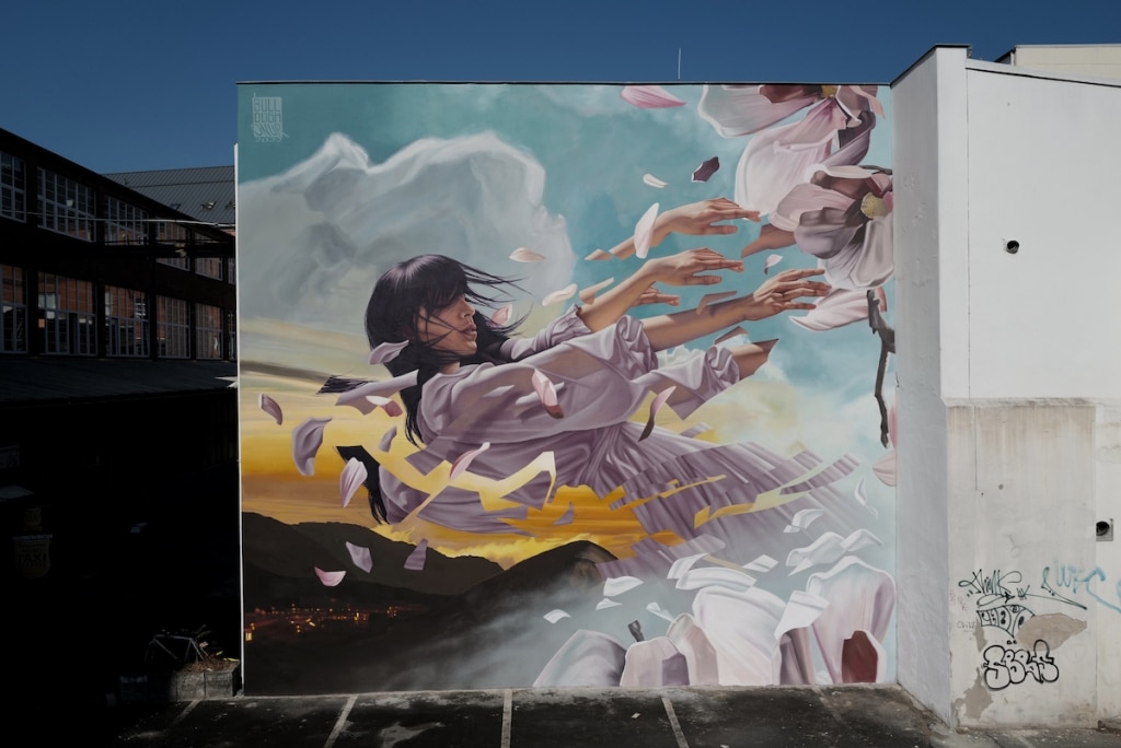 Photorealistic Mural Depicts a Woman Falling Through the Sky