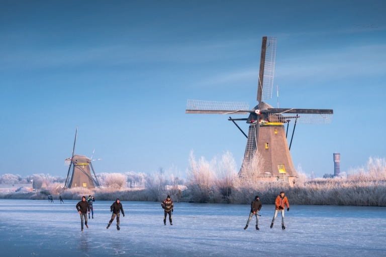 Photographer Captures Enchanting Ice Skating Among Windmills