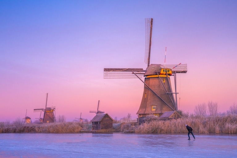 Photographer Captures Enchanting Ice Skating Among Windmills