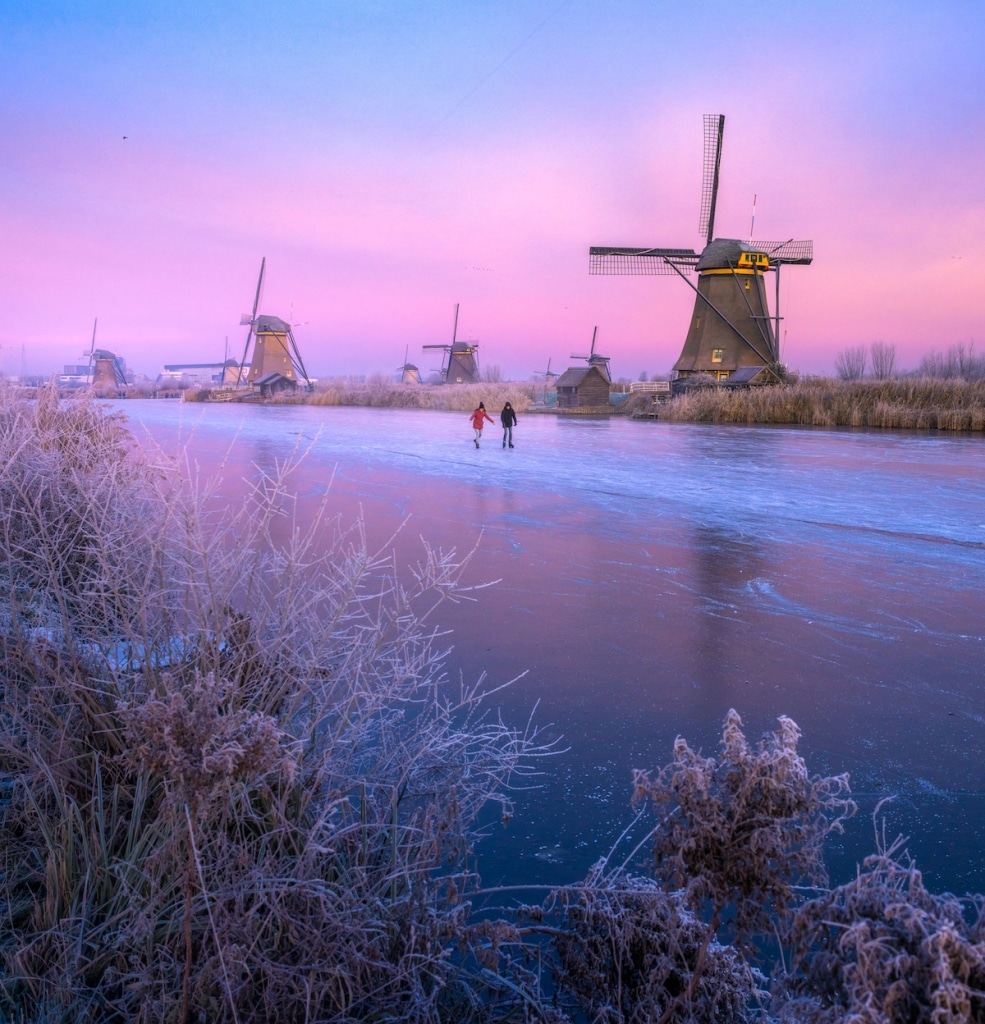 Photographer Captures Enchanting Ice Skating Among Windmills