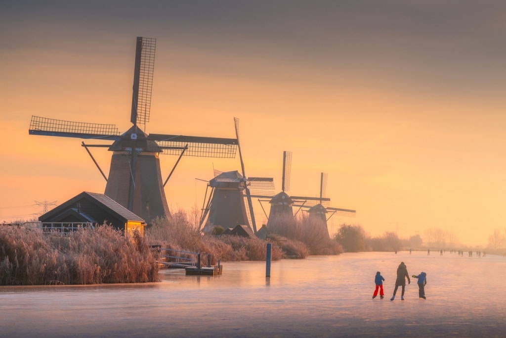 Photographer Captures Enchanting Ice Skating Among Windmills