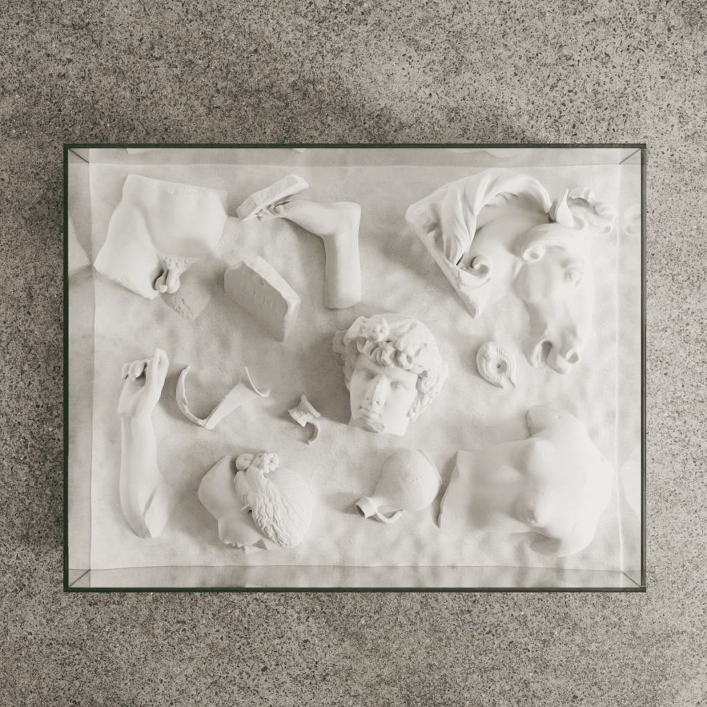 Glass Table Contains Classical Sculptures Inspired by the Past