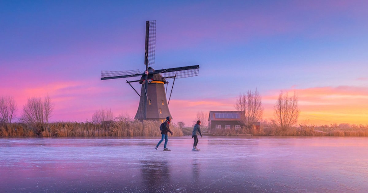 Photographer Captures Enchanting Ice Skating Among Windmills
