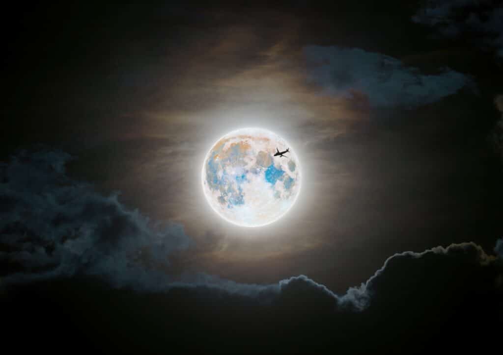 Incredible Photo of JetBlue Flight Passing Over Blue Supermoon