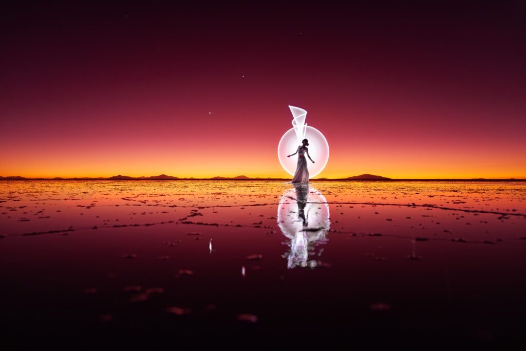 Striking Light Paintings Set Against a Fiery Red Sky at Bolivia’s Uyuni Salt Flat | My Modern Met