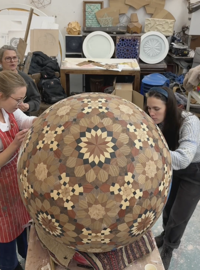 Artist Creates Sphere Sculpture With Hand-Cut Geometric Pattern
