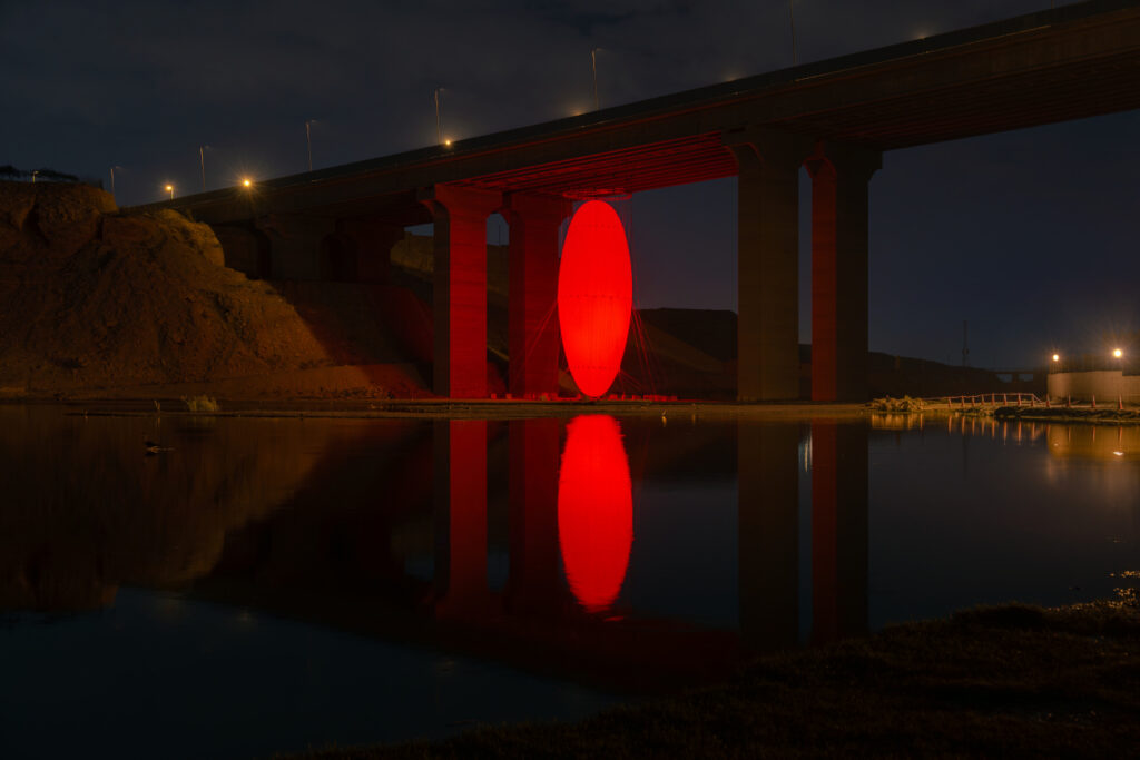 Massive Glowing Ovoid Cloaks City Streets in a Surreal Shade of Red ...