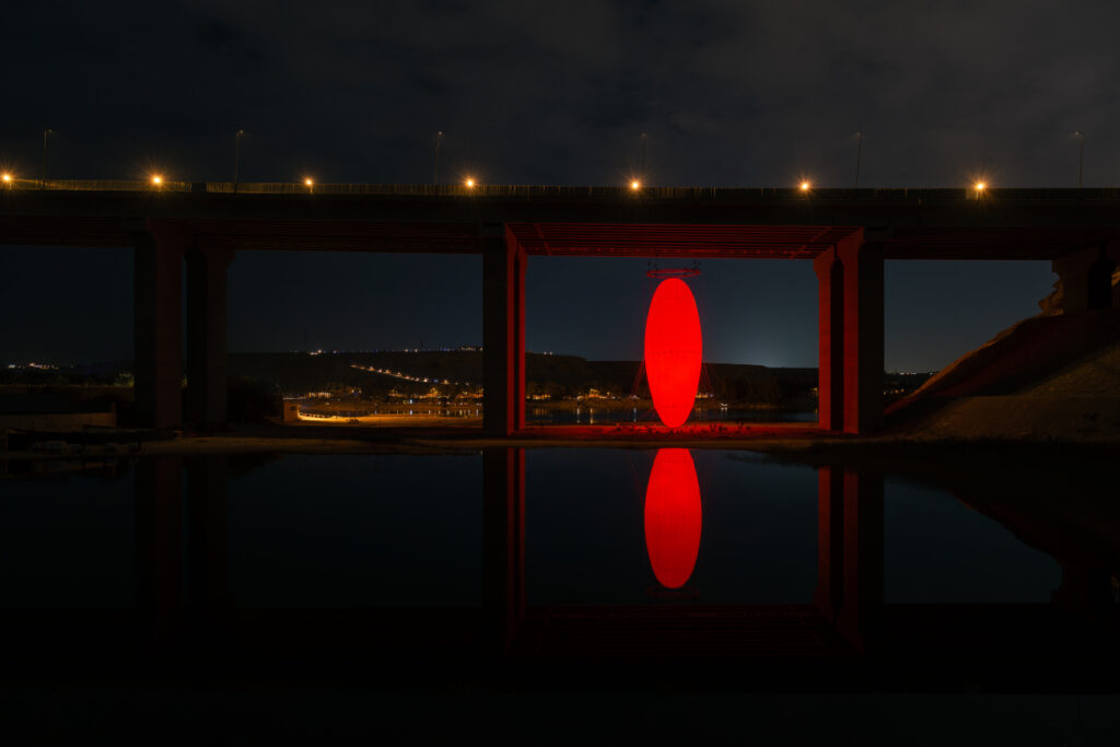 Massive Glowing Ovoid Paints Riyadh in a Surreal Shade of Red