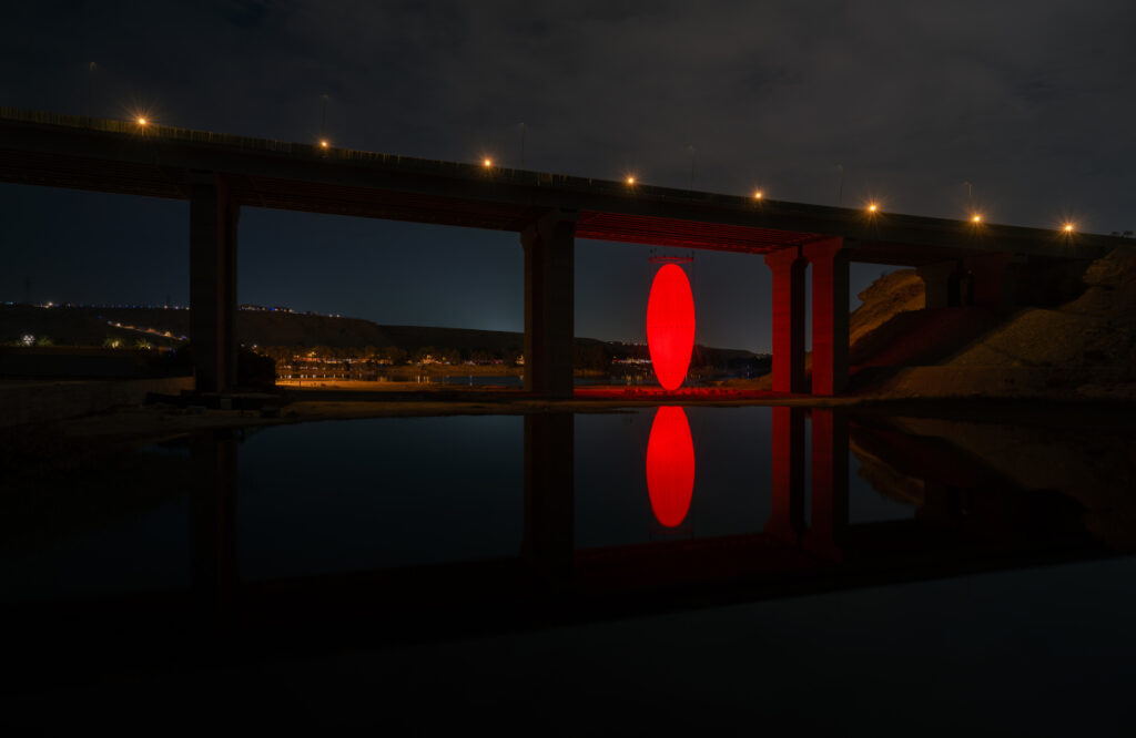 Massive Glowing Ovoid Cloaks City Streets in a Surreal Shade of Red ...