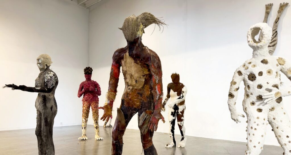 Life-Size Sculptures Explore Living Between Two Worlds